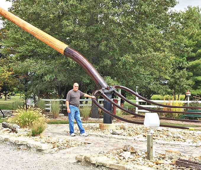 This comparison shot really drives home the absurd scale, making grown adults look like action figures.