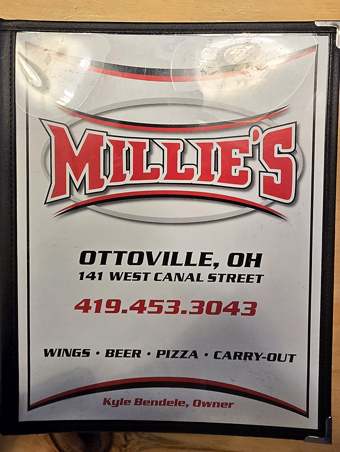 The official Millie's sign &ndash; simple, straightforward, and promising exactly what they deliver: wings, beer, pizza, and happiness.