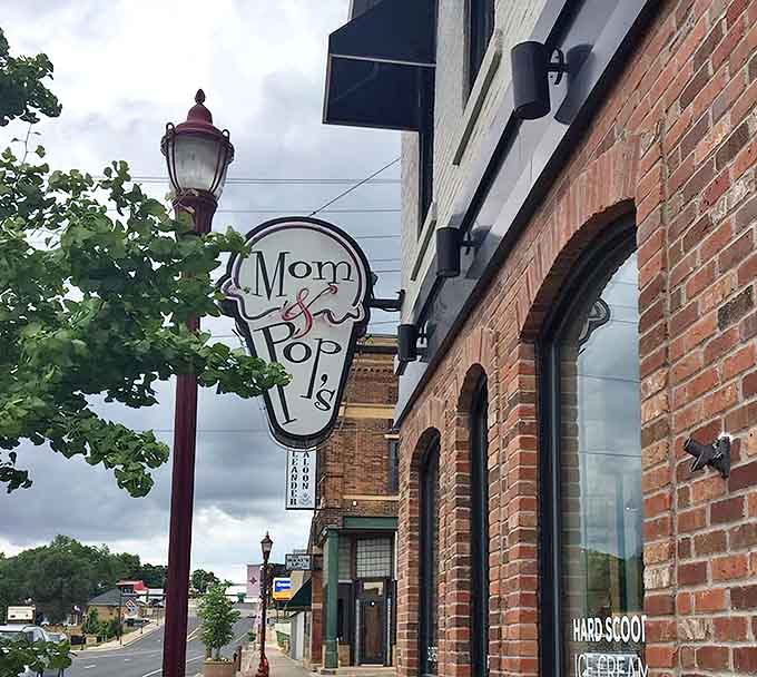 The iconic Mom & Pop's sign serves as a beacon for ice cream pilgrims seeking dairy-free enlightenment in unexpected places.