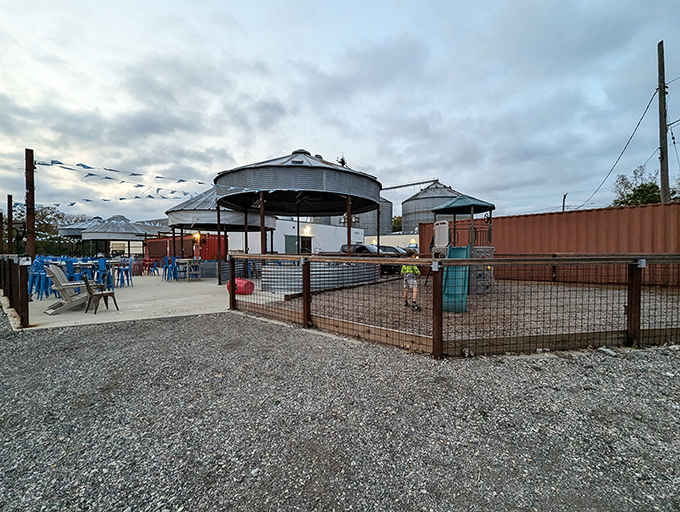 Repurposed grain bins create intimate outdoor havens where string lights promise to transform dusk into something magical.
