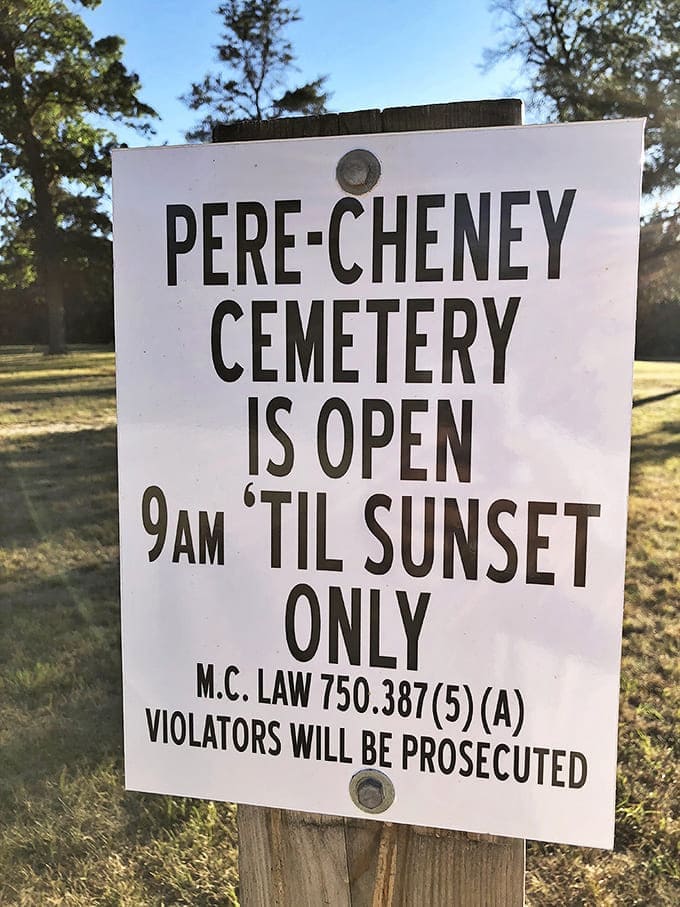 "Open 'til sunset only" &ndash; a reminder that even ghost towns have closing times, especially ones with Pere Cheney's supernatural reputation.