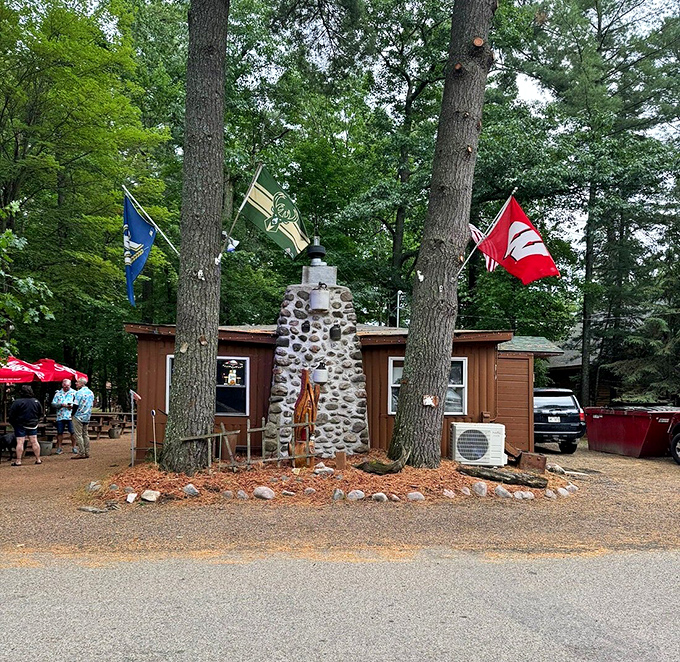The stone chimney and flags create a distinctive landmark that locals and tourists alike recognize instantly.