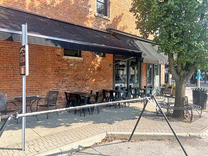 Dappled sunlight plays across outdoor tables where patrons linger, turning simple coffee breaks into mini-vacations on Main Street.
