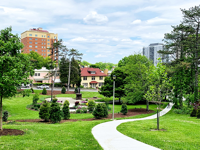 Winding paths invite exploration through Eden Park's rolling landscape, where city stresses melt away with each step.