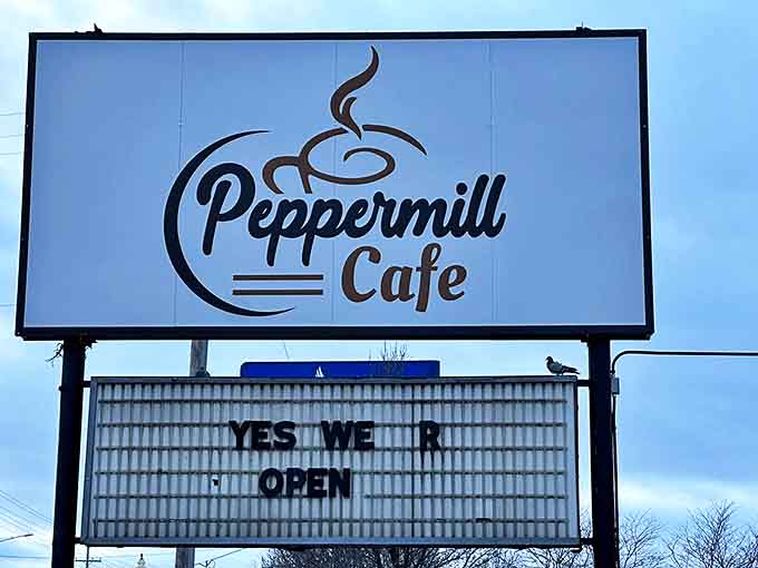 YES WE R OPEN &ndash; six syllables that spark joy for hungry travelers. The Peppermill sign stands as a beacon of breakfast hope along the roadside.