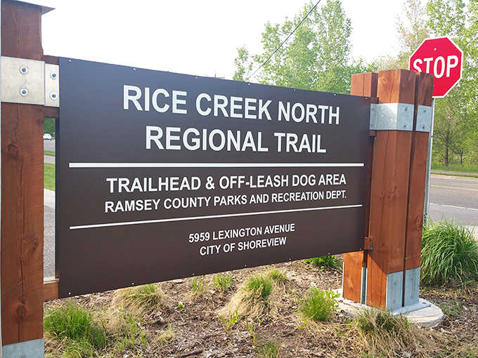 The trail's welcoming sign stands as a portal between everyday life and natural escape &ndash; just steps away from suburban neighborhoods.