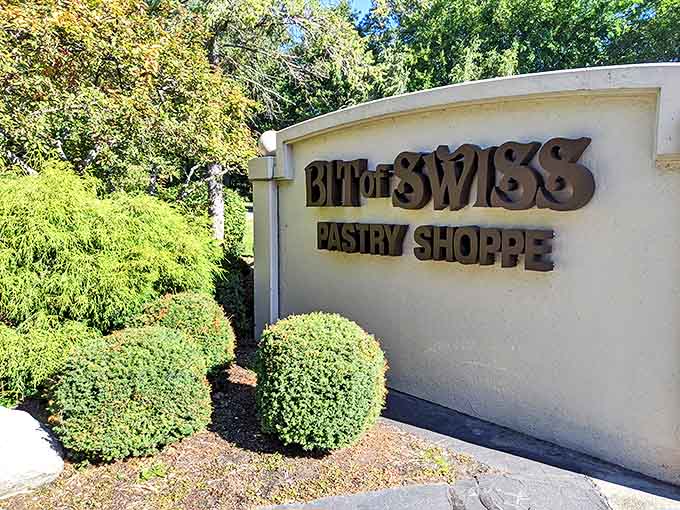 Road Signage: The bakery's name stands proud against a clean white wall &ndash; a beacon for carb-seekers and sweet-tooths alike.