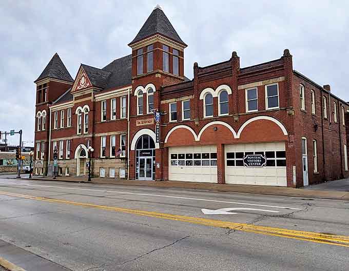 The museum's exterior showcases its dual heritage as both historic firehouse and Route 66 shrine, standing proud on Pontiac's streetscape.