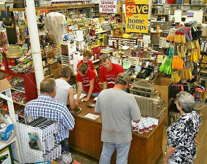 The heart of community commerce happens at this counter, where transactions are secondary to the exchange of stories, advice, and neighborly connections.