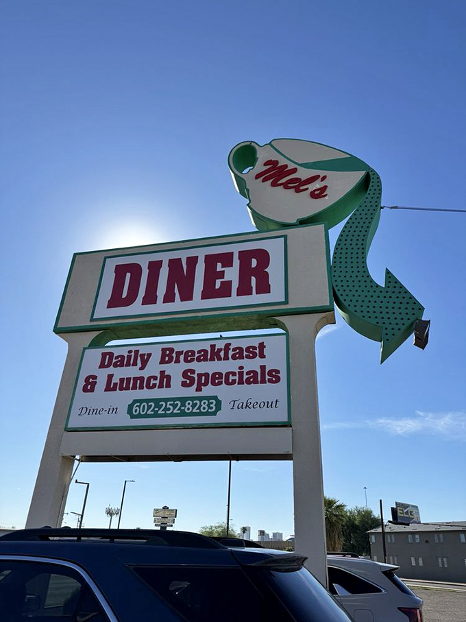 That iconic coffee cup sign against the blue Arizona sky &ndash; a beacon of breakfast hope for hungry travelers and locals alike.