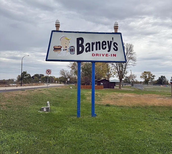 Step back in time at Barney's Drive-In, where the iconic vintage signage and smiling mascot welcome you for classic Minnesota treats.