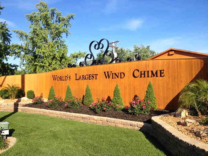"World's Largest Wind Chime" &ndash; Casey's charming directional sign points visitors toward all their record-breaking attractions.