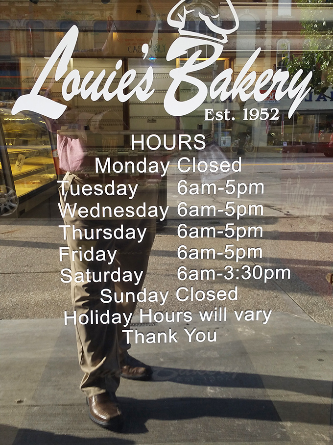 The store hours sign—memorize it, cherish it, plan your life around it. When Louie's is open, all is right with the world.