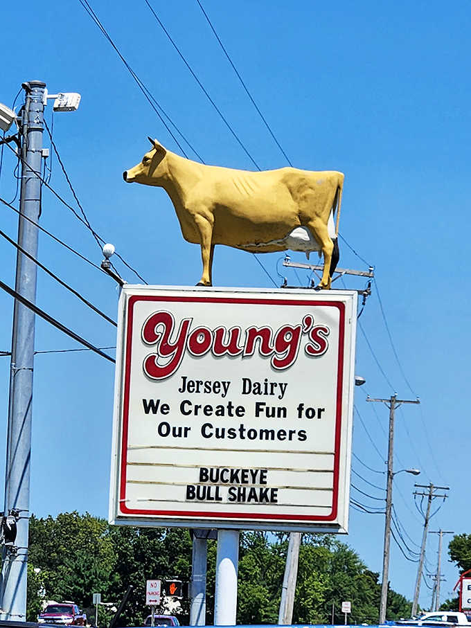 The roadside sign topped with the famous yellow cow announces your arrival at dairy paradise. This bovine beacon has guided hungry travelers for generations.
