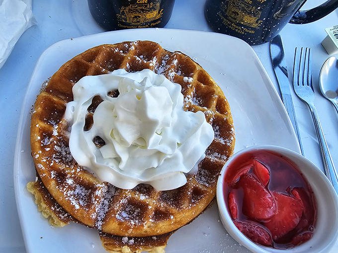 A Belgian waffle crowned with whipped cream and fresh strawberries &ndash; the sweet counterpoint to all those savory Benedicts, and no less magnificent.