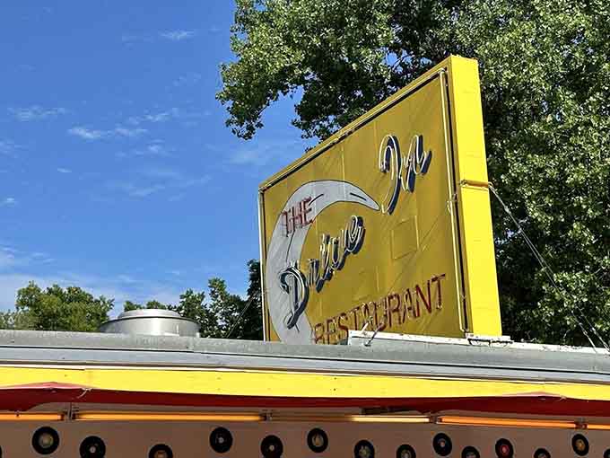 That yellow sign and vintage architecture signal you've arrived somewhere special, where nostalgia and quality meet deliciously.