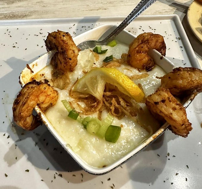 Shrimp & Grits that would make a Southern grandmother proud &ndash; creamy, cheesy grits crowned with perfectly seasoned Gulf shrimp.