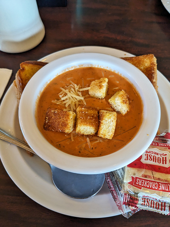 Tomato bisque that's richer than most bank accounts, topped with cheese and croutons &ndash; comfort in a bowl that warms from the inside out.