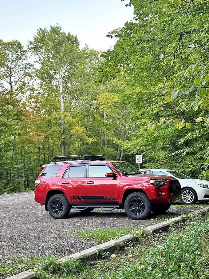 The parking area &ndash; where everyday vehicles transform into chariots of adventure and the ordinary world gets left behind with your cell signal.