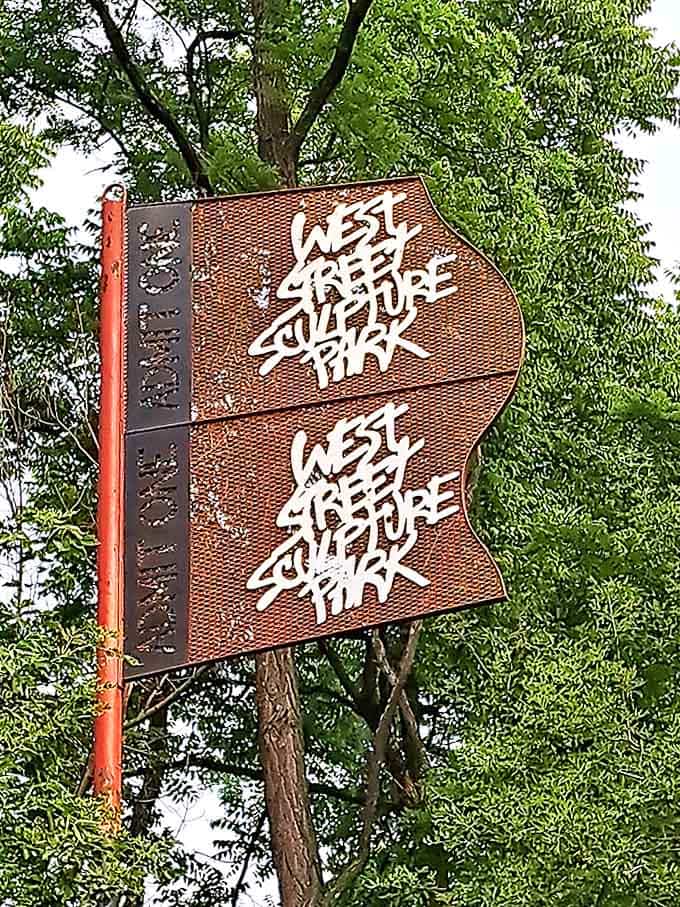 The sculpture park sign welcomes you twice, because once just isn't enough when you're about to enter this wonderland.