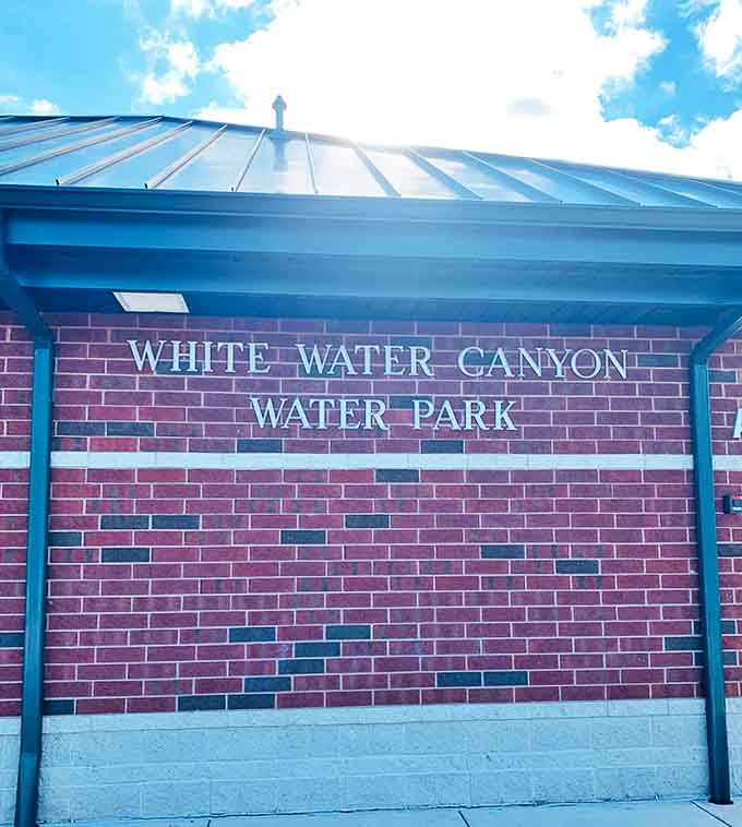 Simple brick and mortar announcing the gateway to summer magic, no fancy marketing needed when the fun speaks for itself.