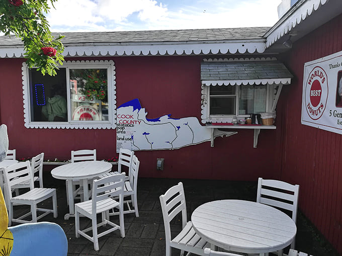 White tables and chairs provide the perfect perch for savoring donuts while contemplating life's important questions, like which flavor to try next.