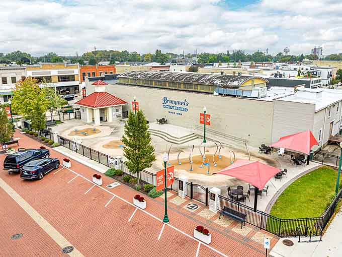The community splash pad becomes summer's epicenter, where children dash through water features while parents pretend they're not jealous.