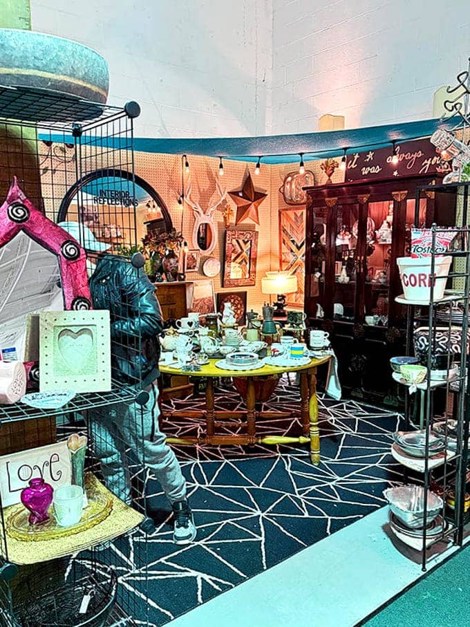 Tea time frozen in amber &ndash; this charming booth arrangement invites visitors to imagine the conversations that might happen around that yellow table set with vintage china.