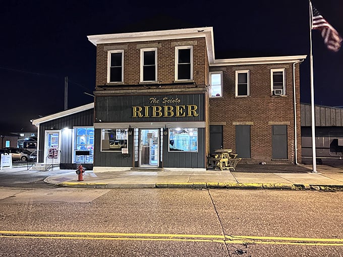 The nighttime exterior glows with promise, a beacon for hungry travelers seeking authentic barbecue in southeastern Ohio.