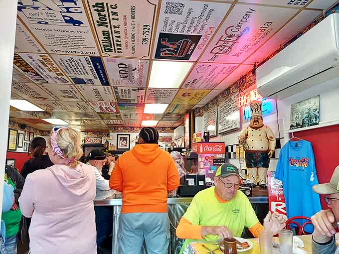 The bustling interior showcases ceiling tiles plastered with local business cards &ndash; a Yellow Pages directory suspended above hungry diners.
