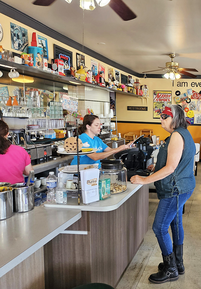 Where transactions become interactions &ndash; the cashier area doubles as command central for this breakfast operation, complete with tempting baked goods on display.