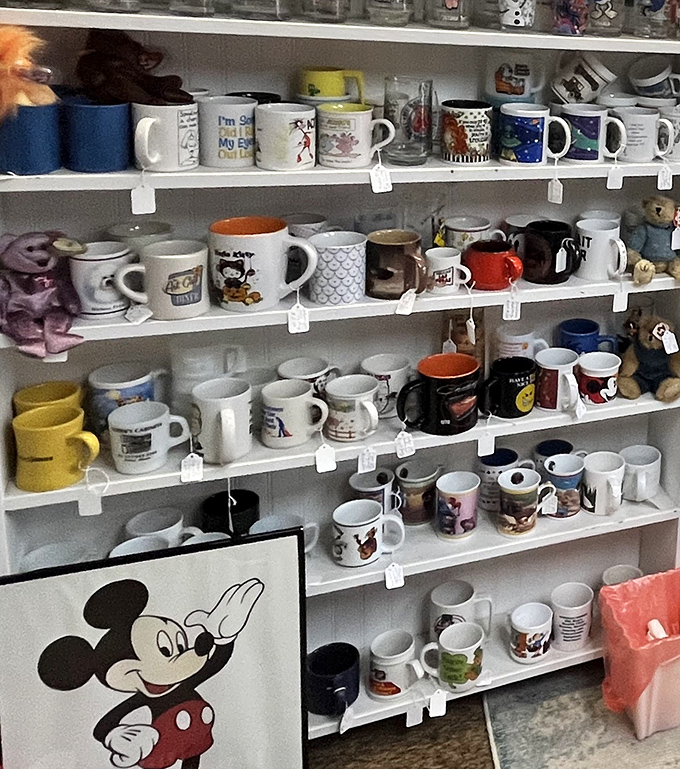 Mickey watches over a kingdom of mugs – Disney memorabilia shares shelf space with souvenir cups from across America in this collector's corner.