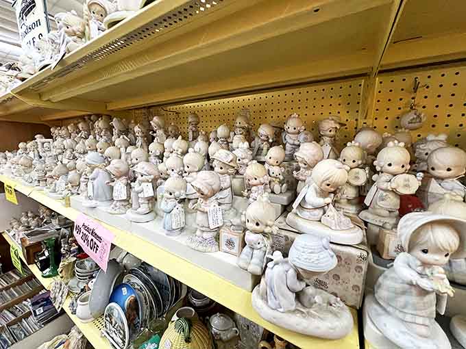 An army of Precious Moments figurines with their teardrop eyes seems to silently judge your life choices from their perch on the shelf.