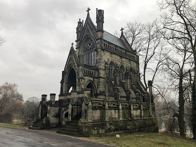 This Gothic Revival mausoleum looks like it materialized from a Victorian ghost story, its dramatic spires piercing the misty sky.