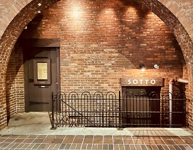 The arched entryway frames Sotto's door like a portal to another world &ndash; one where time slows down and flavors take center stage.