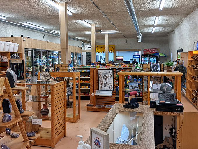 The gift shop's wooden shelves display treasures from both prehistoric times and modern Arizona, tempting visitors with take-home memories.