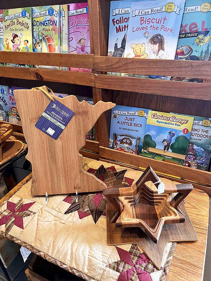 The children's corner features Minnesota-shaped cutting boards alongside classic books, introducing the next generation to state pride and reading adventures.
