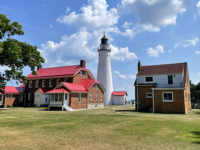 The Fort Gratiot Light Station complex stands as a testament to maritime history, looking exactly like what you'd picture if someone said "classic Great Lakes lighthouse" in a word association game.
