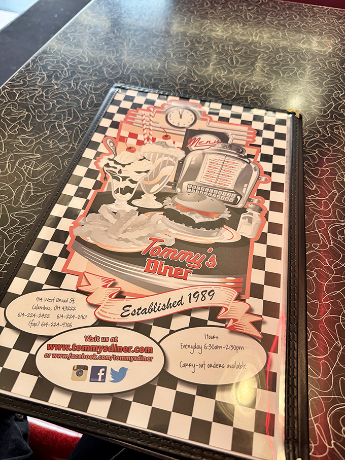 The menu cover says everything you need to know: established 1989, checkerboard pattern, and the promise of classic American diner fare done right.