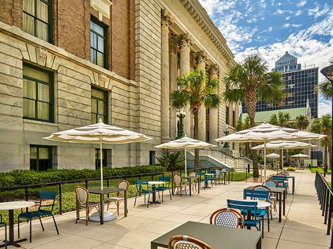 Outdoor Patio: Courthouse columns provide a dramatic backdrop for al fresco dining where palm trees remind you you're still in sunny Florida.