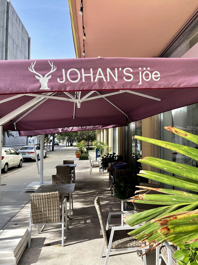 Outdoor patio: Pink umbrellas shade comfortable seating where you can people-watch while savoring Swedish treats &ndash; vacation vibes without the airfare.