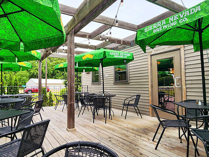 The outdoor seating area transforms summer evenings into magical experiences, where string lights twinkle above tables of contented diners.