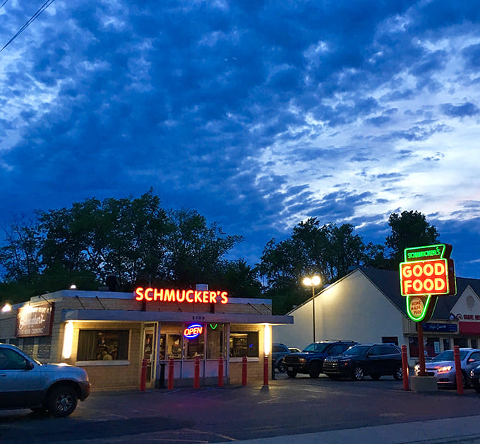 As twilight falls, Schmucker's neon glow becomes a beacon for hungry souls seeking comfort food and conversation in equal measure.