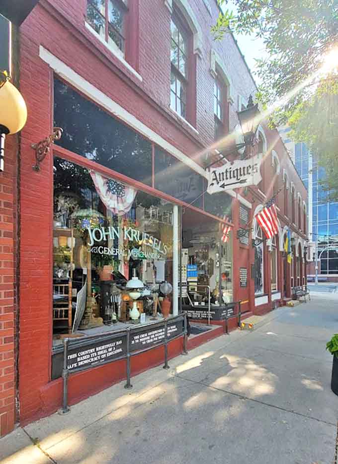 Sunlight plays across the historic red brick exterior, highlighting the vintage charm of this downtown Rochester institution dedicated to preserving the past.