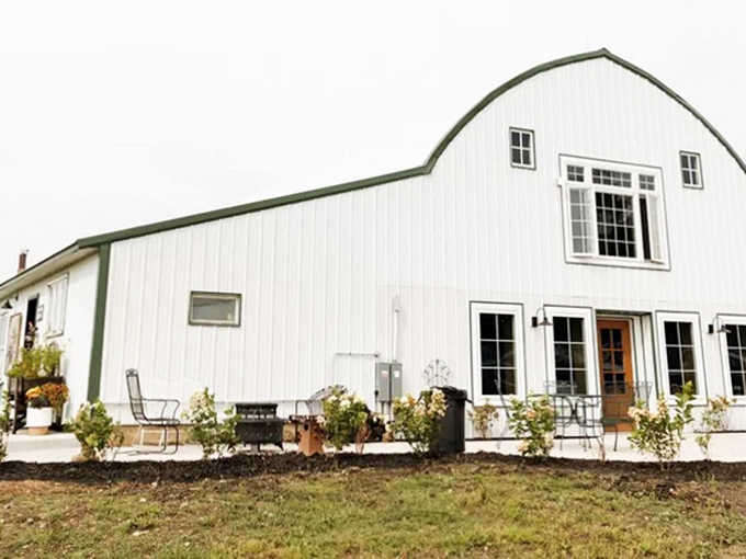 The barn's distinctive silhouette creates a postcard-perfect scene that will have you reaching for your camera before unpacking.