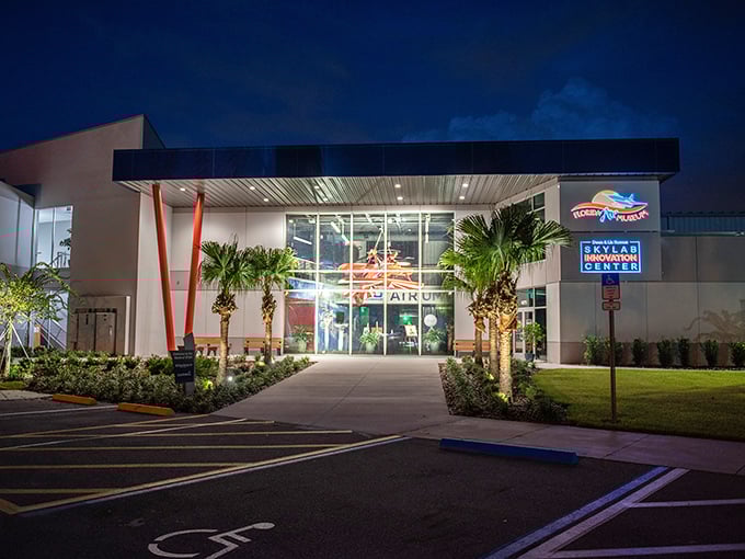 The museum's modern entrance glows invitingly at twilight, promising adventures in aviation history. Like a portal to the past, it beckons visitors into a world of wings and wonder.