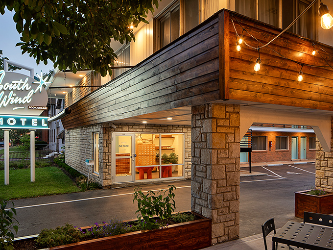 Warm wood accents and limestone create a welcoming entrance that bridges the gap between nostalgic charm and modern hospitality.
