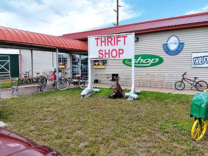 The welcoming exterior with its straightforward "THRIFT SHOP" sign &ndash; an understated invitation to the treasure hunt that awaits inside.