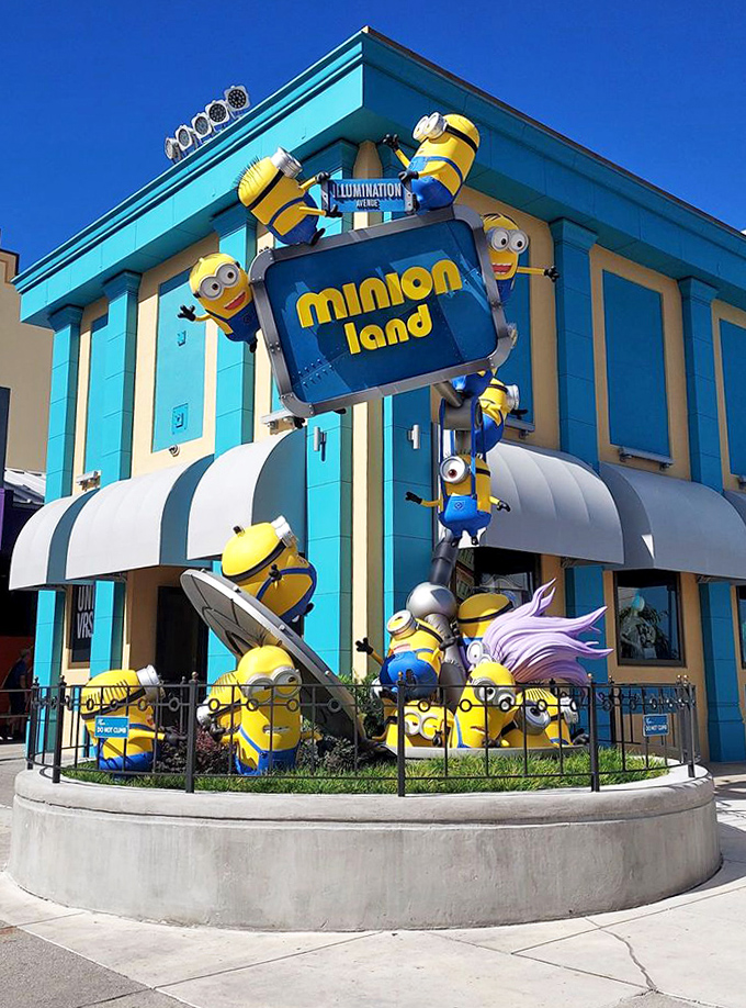 Outside, a battalion of Minions scales the building's facade, creating an unmistakable landmark that draws visitors like bees to a banana-colored hive.