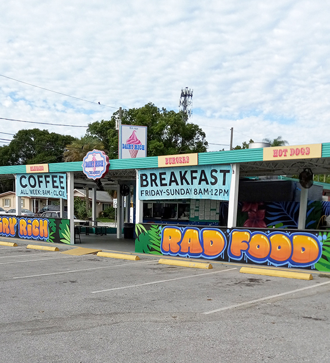 Morning light catches Dairy Rich's colorful signage, promising breakfast Friday through Sunday and coffee all week &ndash; because some pleasures shouldn't wait for afternoon.